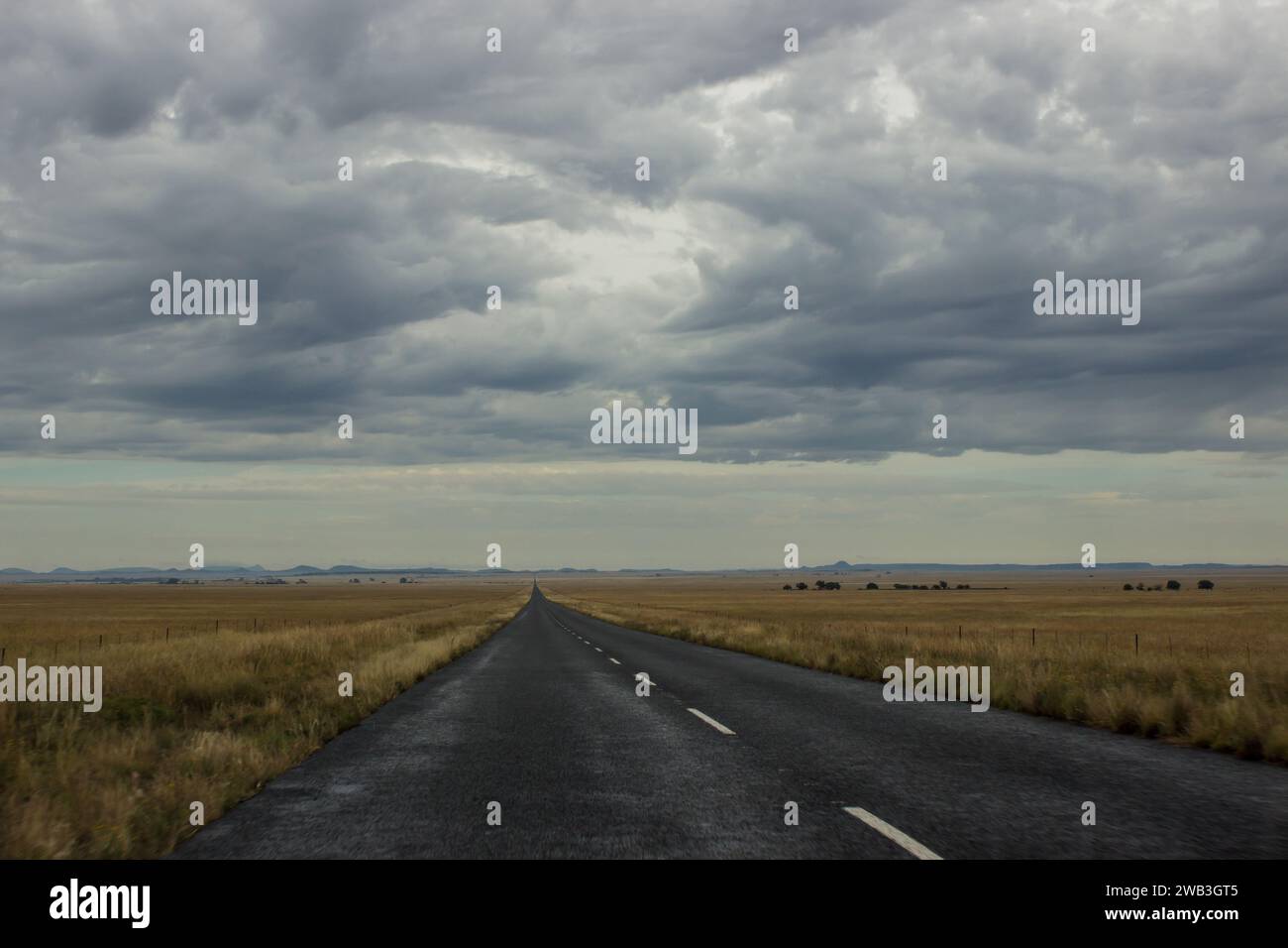 Empty open road disappearing into the distance of the vast expanse of ...