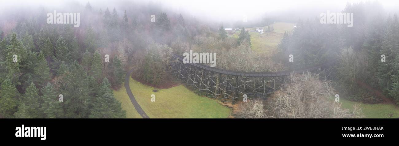 Low rain clouds drift across the Banks Vernonia trail, an old railroad ...