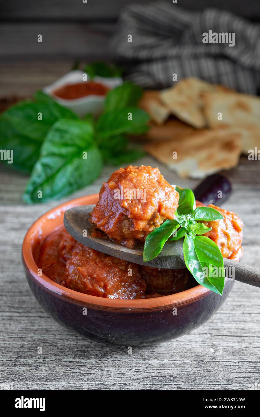Neapolitan meatballs with meat sauce ragu in earthenware dish Stock ...
