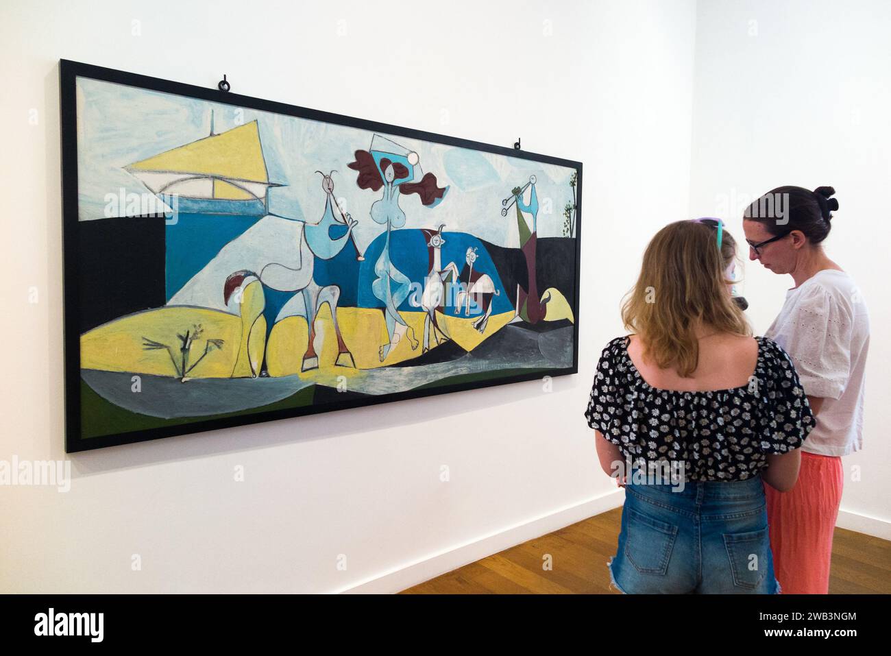 Mother & daughter visit to look at art. Pablo Picasso painting on display in Musée Picasso ...