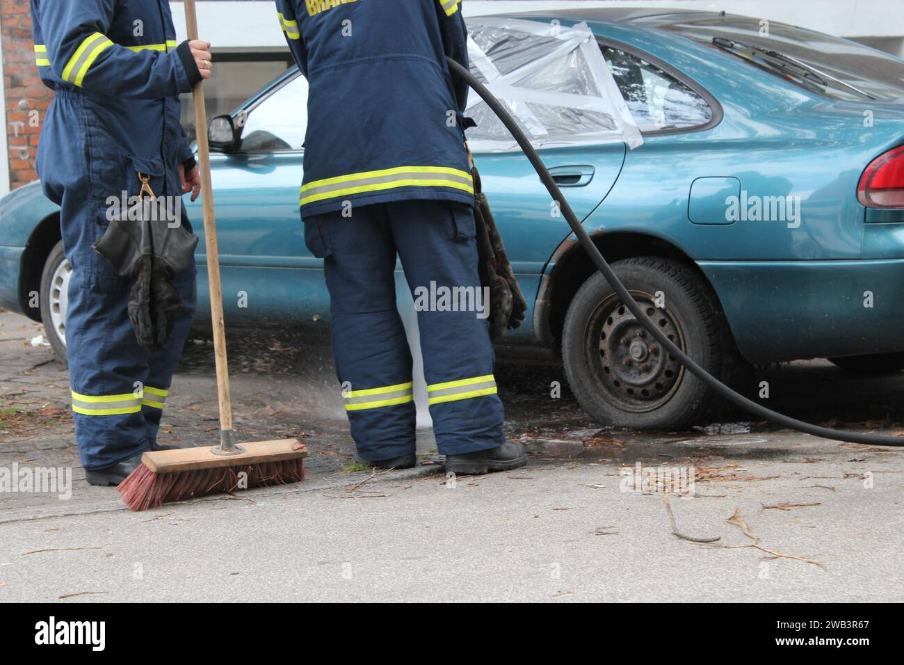 Fire brigade cleaning up street hi-res stock photography and images - Alamy