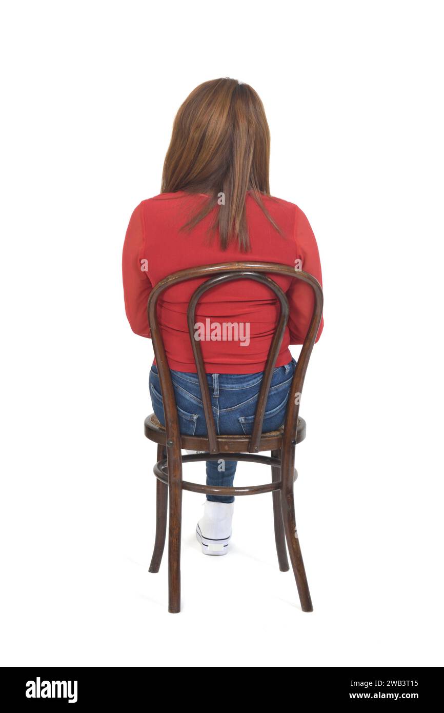 back view of a woman sitting on chair on white background Stock Photo ...