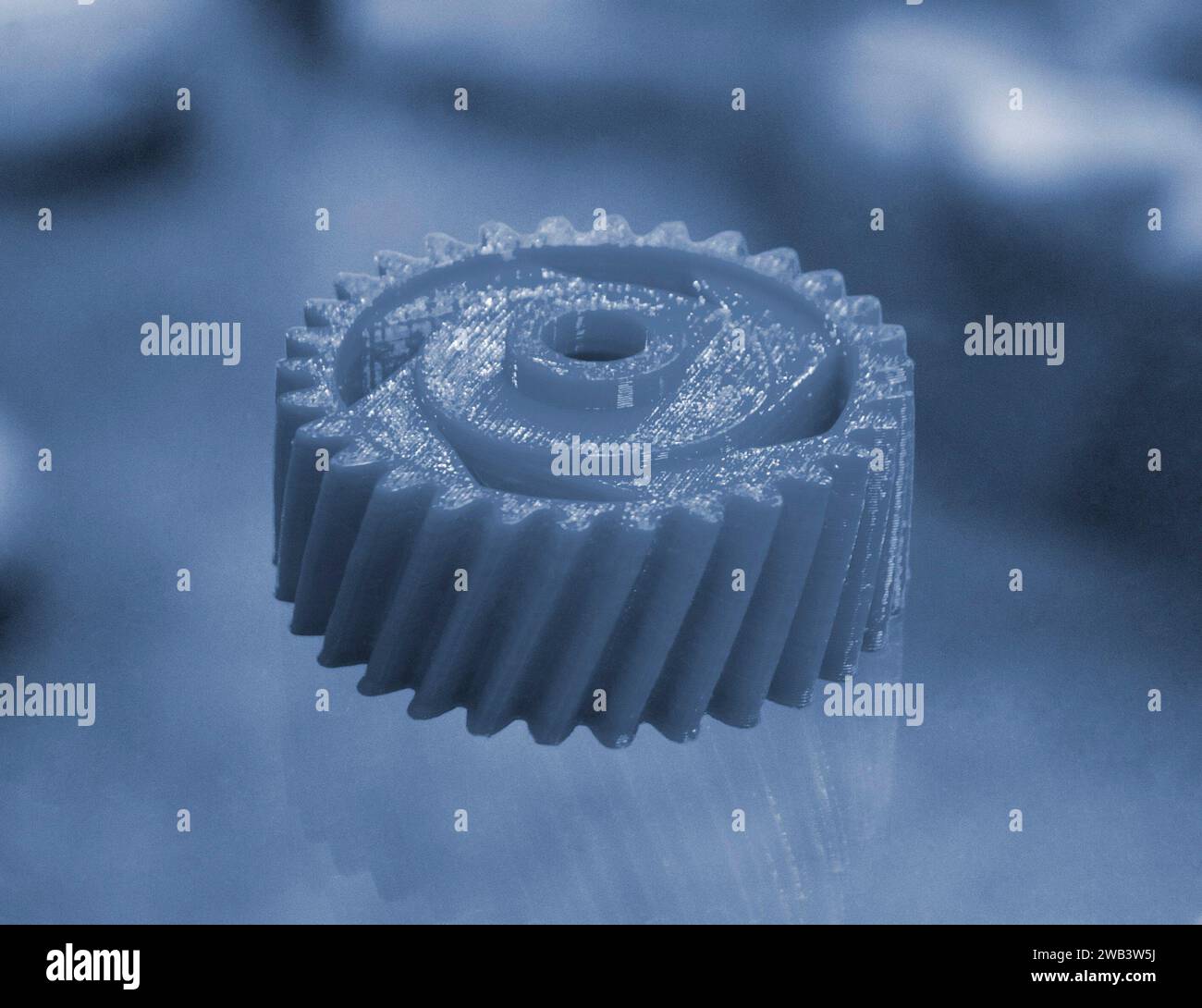 Many blue detail printed on 3D printer close-up. Part 3D printed from ...