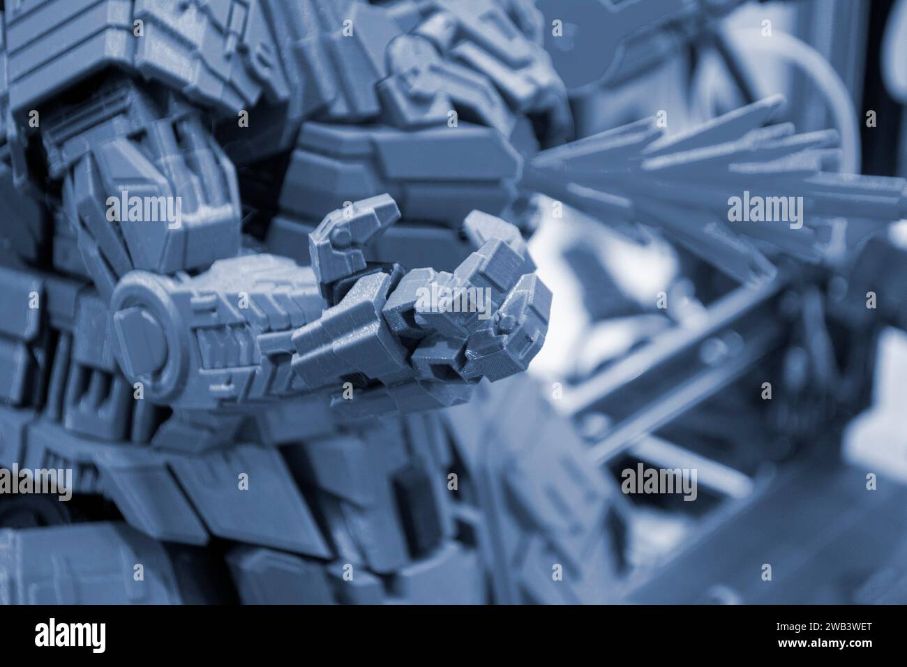 Art object printed on 3D printer. Robot toy created on 3D printer. Blue ...