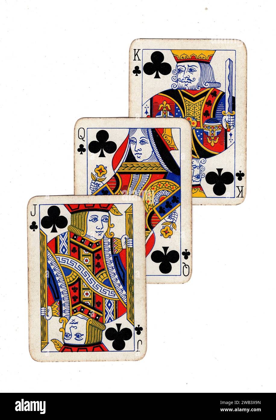 Vintage playing cards showing a jack, queen and king of clubs on a ...