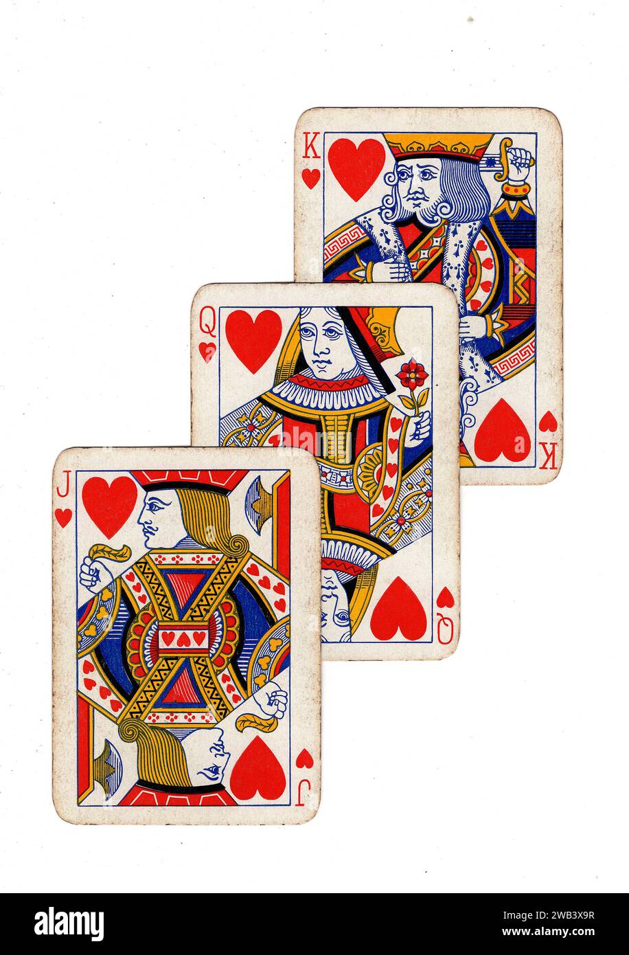 Vintage playing cards showing a jack, queen and king of hearts on a ...