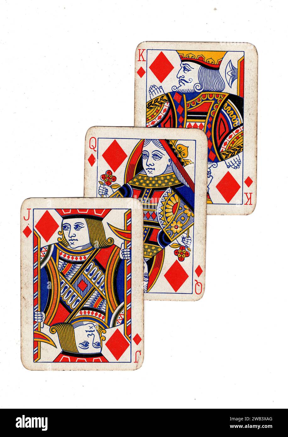 Vintage playing cards showing a jack, queen and king of diamonds on a ...