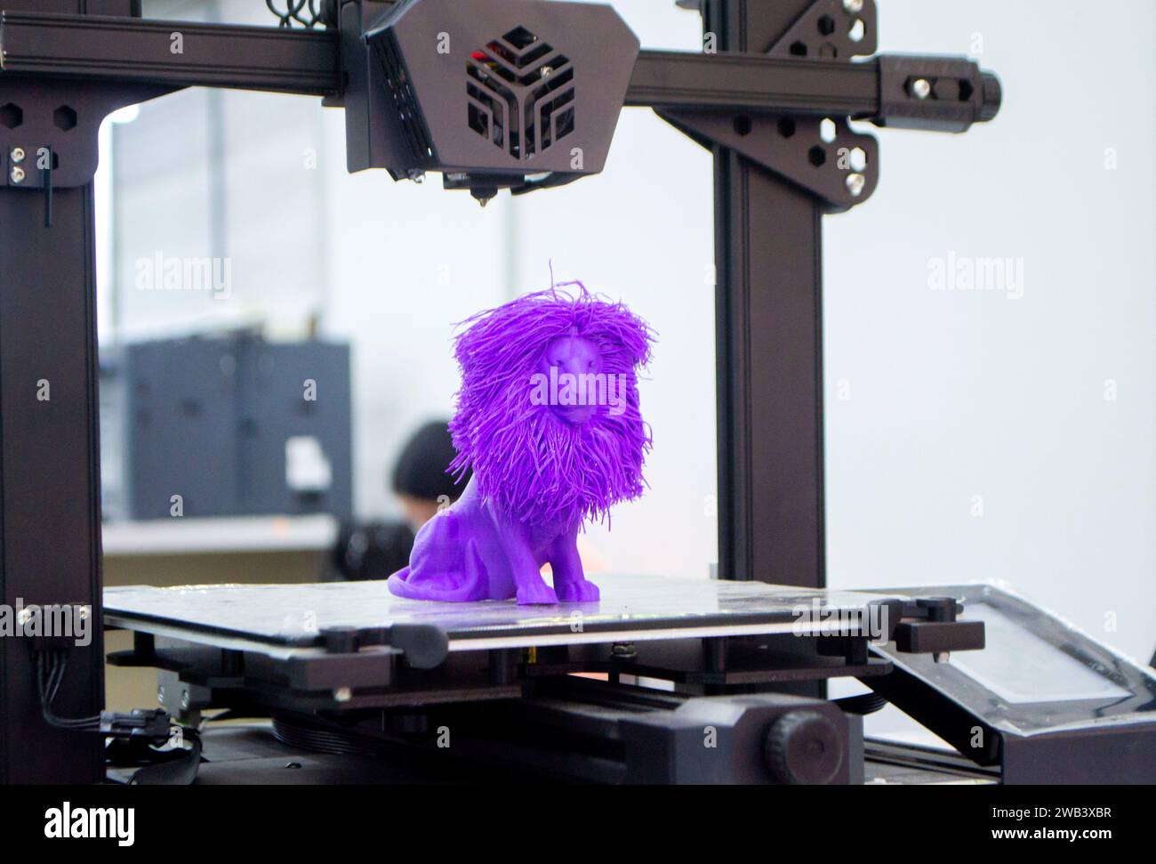 Model of toy lion printed on 3D printer from melted plastic purple ...