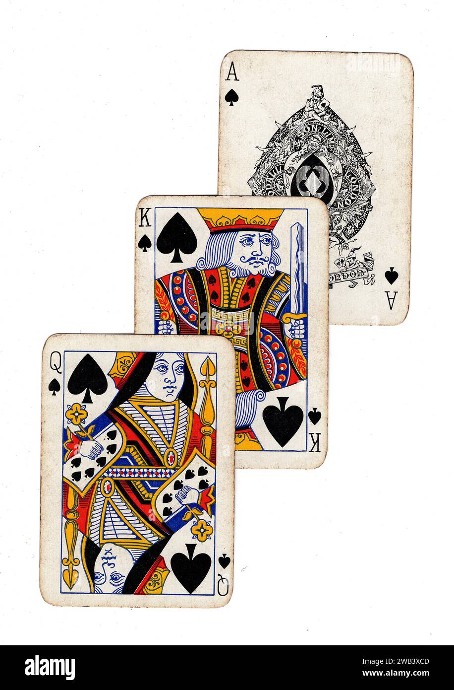 Vintage playing cards showing a queen, king and ace of spades on a ...