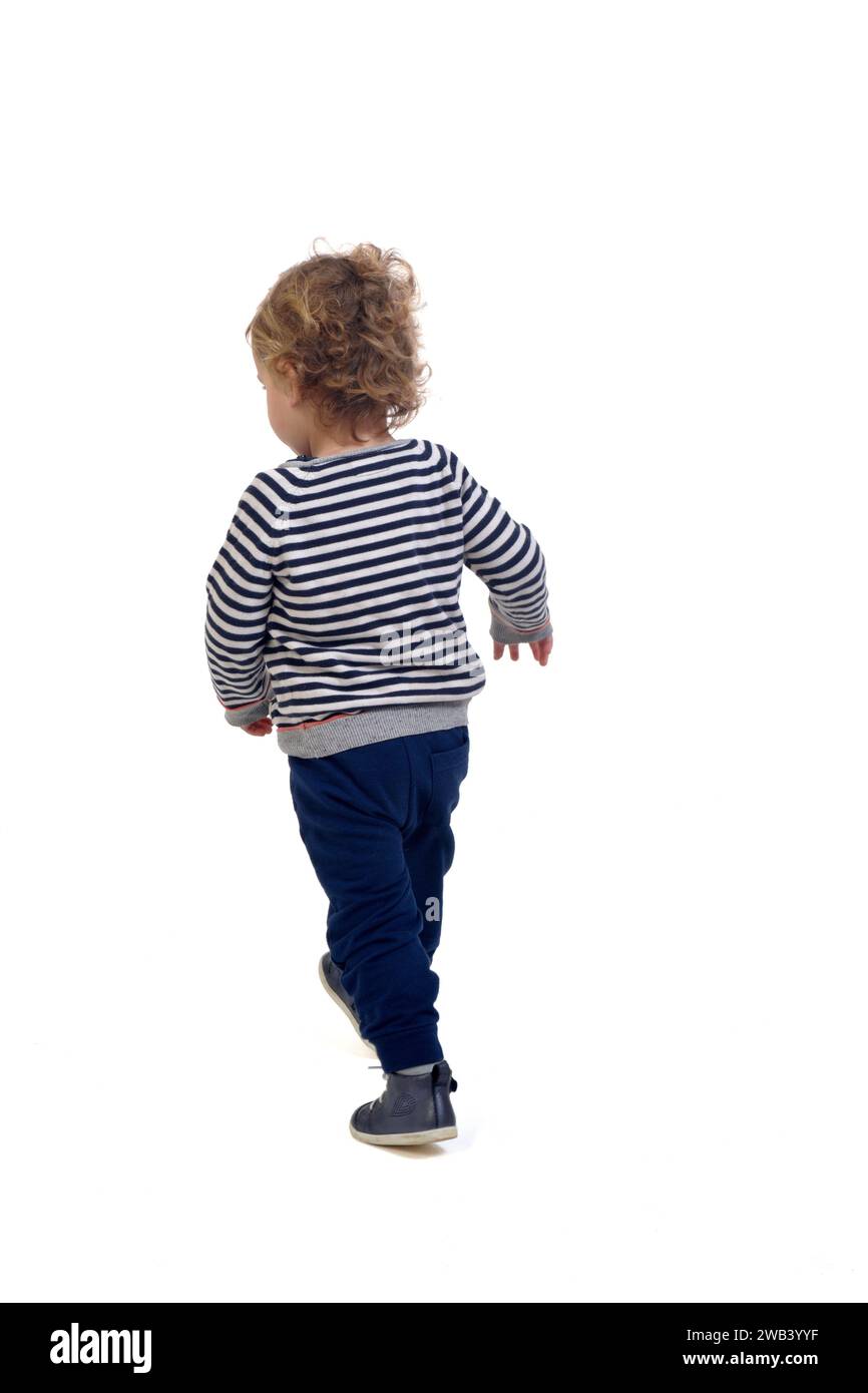 back view of a baby boy walking on white background Stock Photo - Alamy