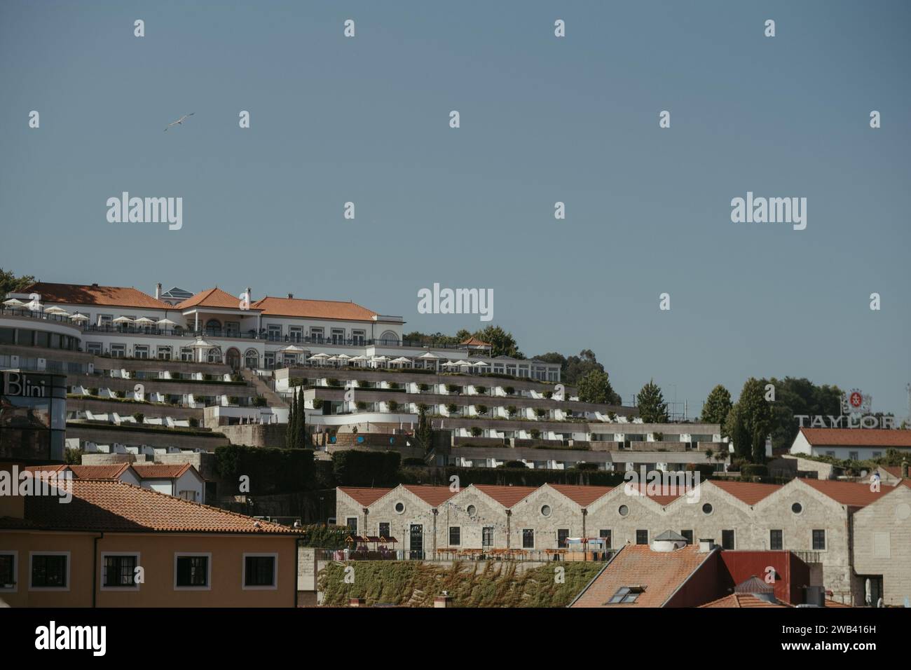 An aerial view of a sprawling cityscape with multiple buildings ...