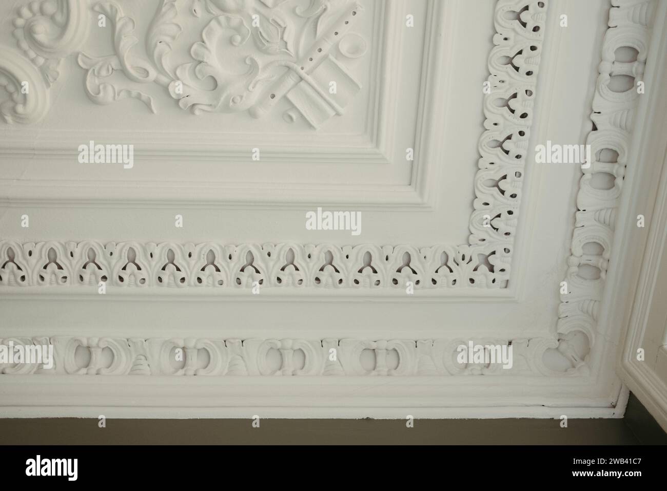 This is an elegant ceiling featuring a white painted finish and a round ...