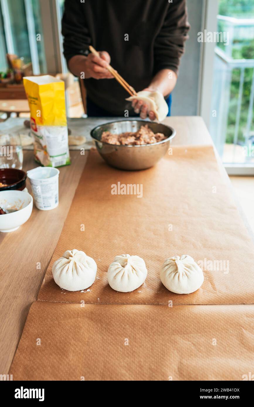 Raw bao on a table Stock Photo - Alamy