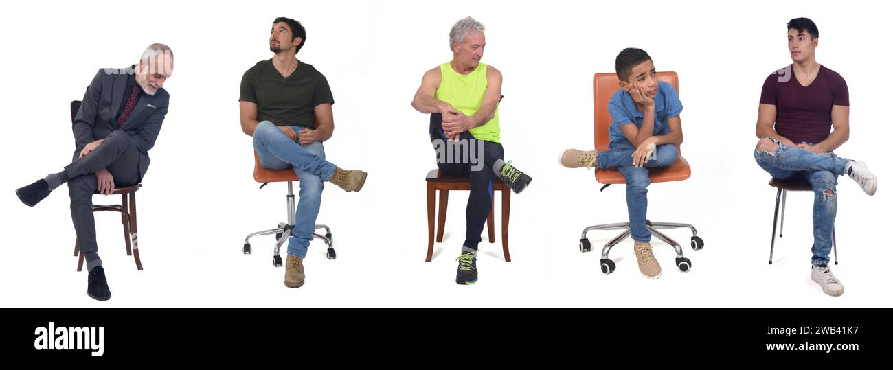 group of men sitting looking everywhere on white background Stock Photo ...