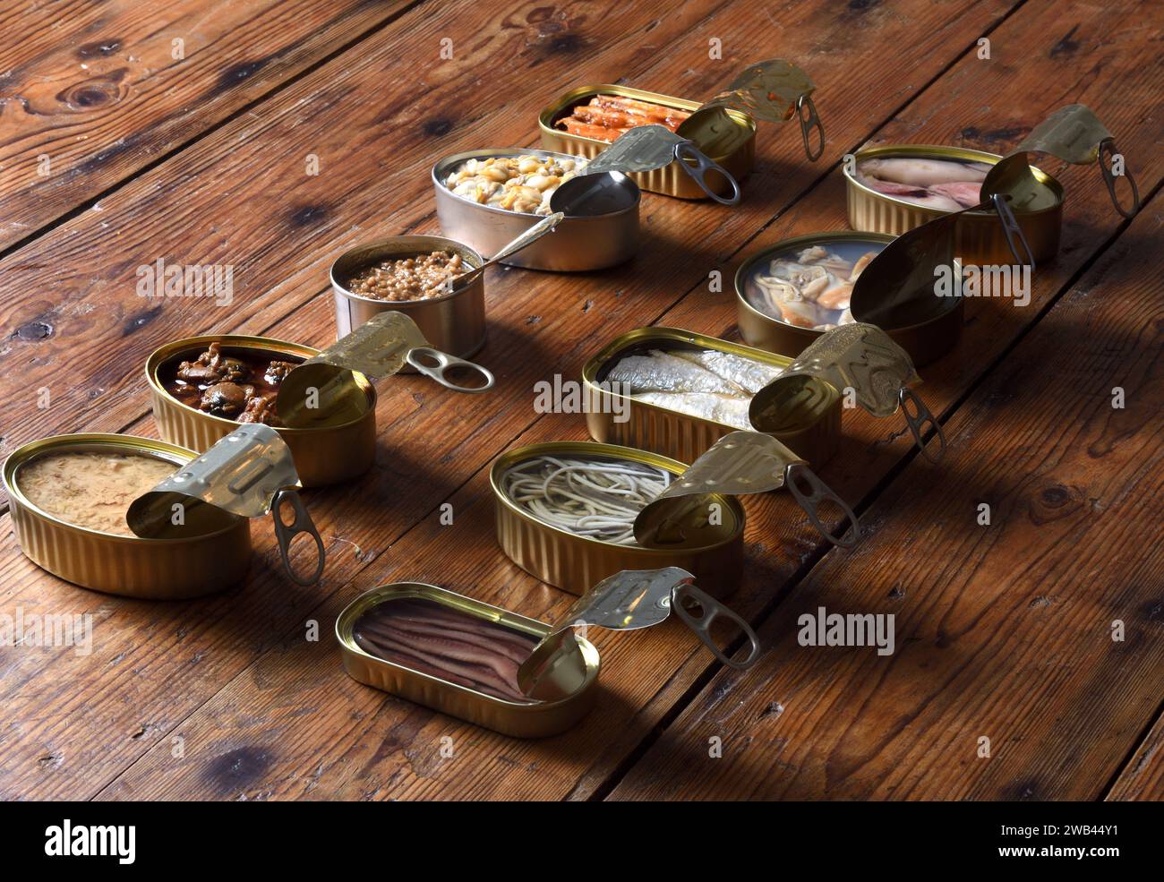 set of cans with fish and seafood on wooden background Stock Photo - Alamy