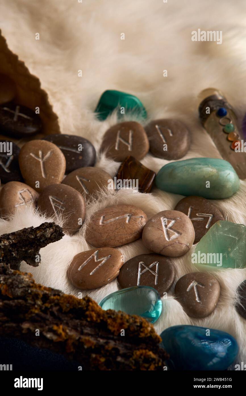 handmade stone runes on white fur Stock Photo - Alamy