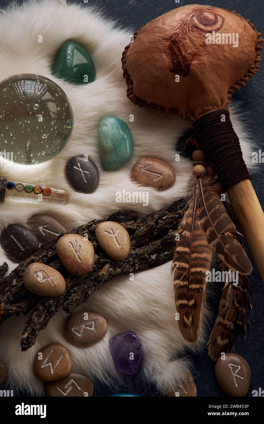 handmade stone runes on white fur Stock Photo - Alamy