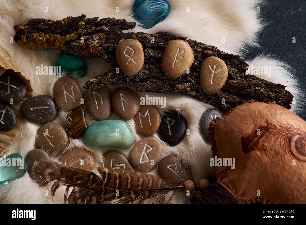 handmade stone runes on white fur Stock Photo - Alamy