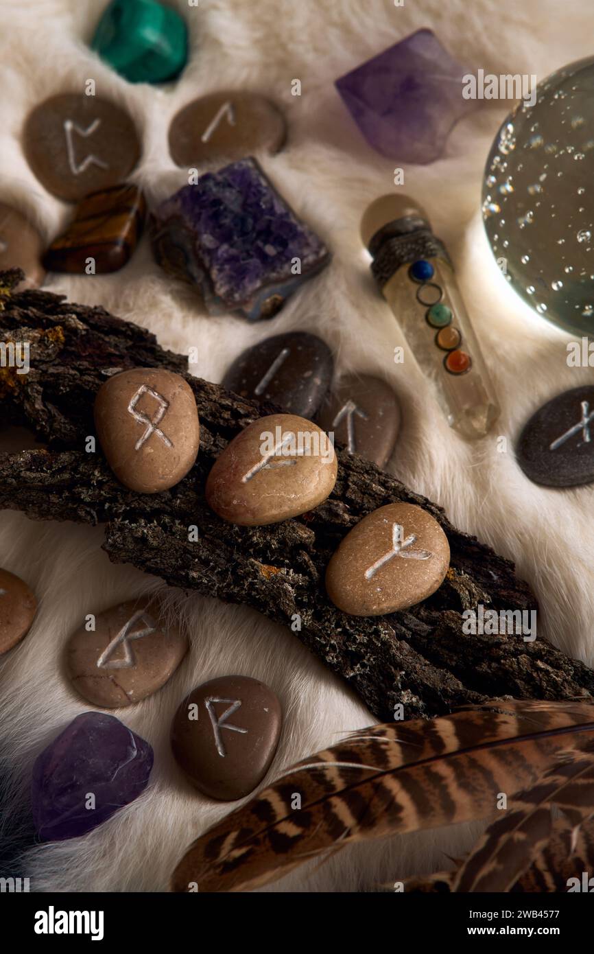 handmade stone runes on white fur Stock Photo - Alamy