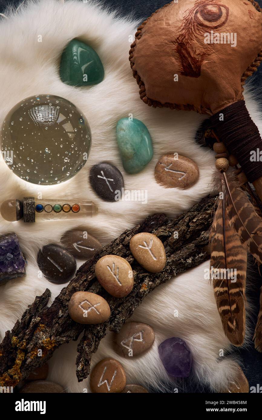 handmade stone runes on white fur Stock Photo - Alamy