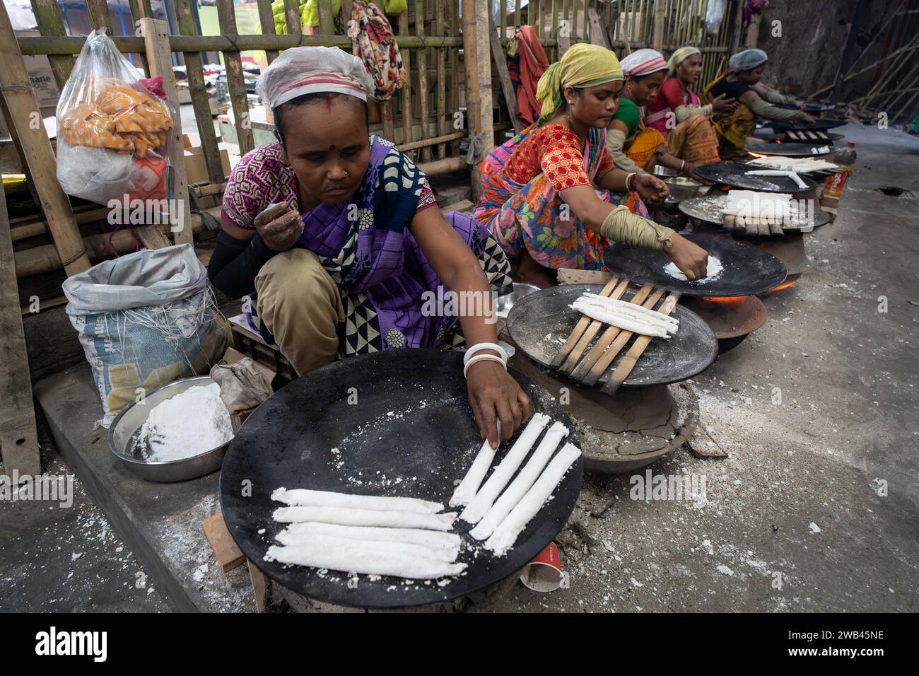 Guwahati, Assam, India. January 8, 2024. Women makes Assamese ...