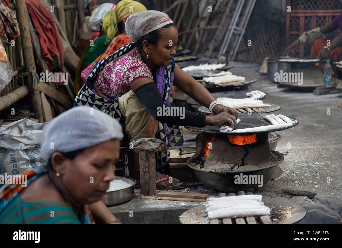 Guwahati, Assam, India. January 8, 2024. Women makes Assamese ...
