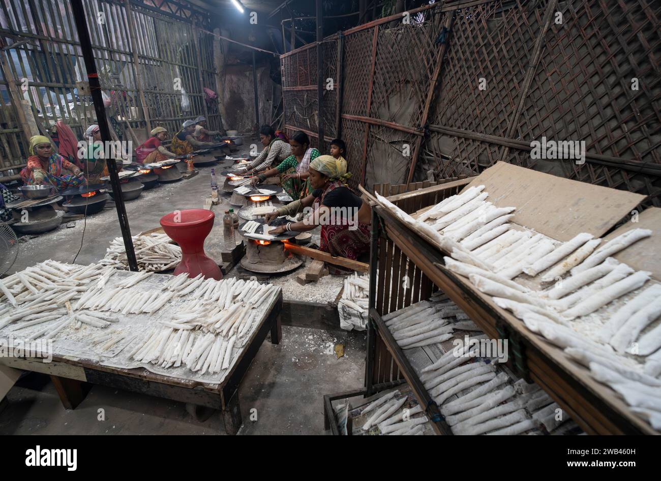 Guwahati, Assam, India. January 8, 2024. Women makes Assamese ...