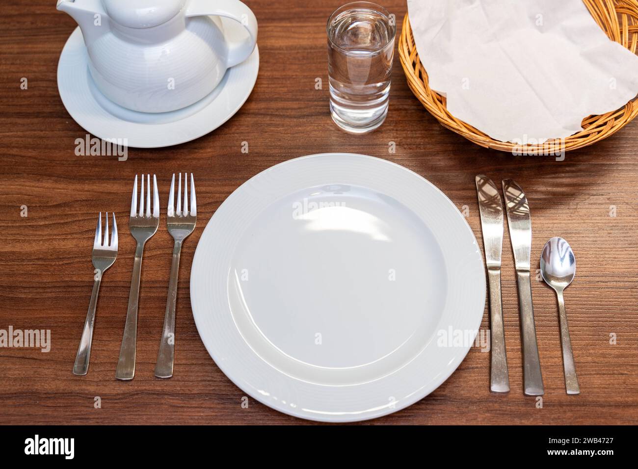 Bavaria, Germany - January 6, 2024: Set table with plates and cutlery ...