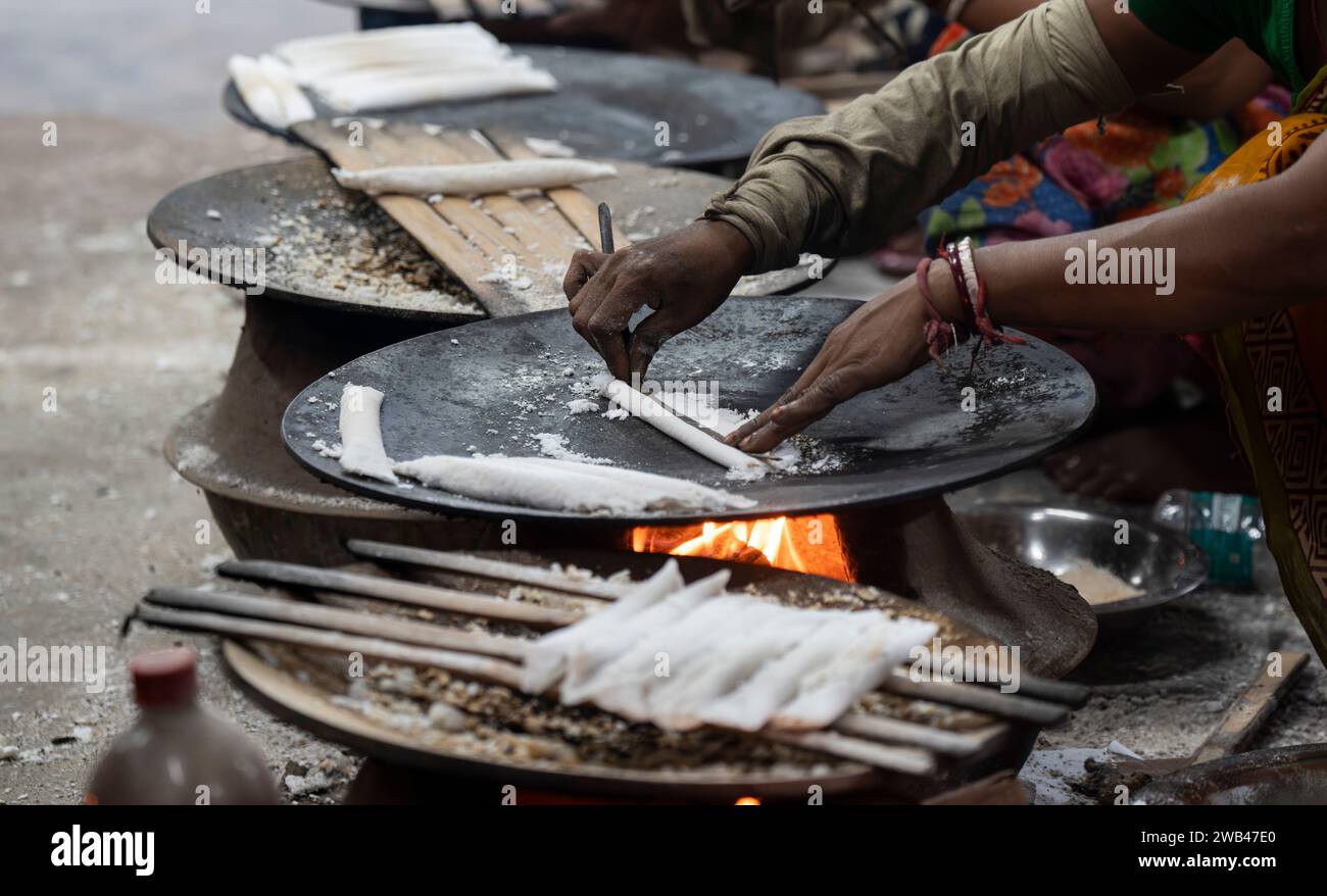 January 8, 2024: Women makes Assamese traditional pitha (Rice cake ...