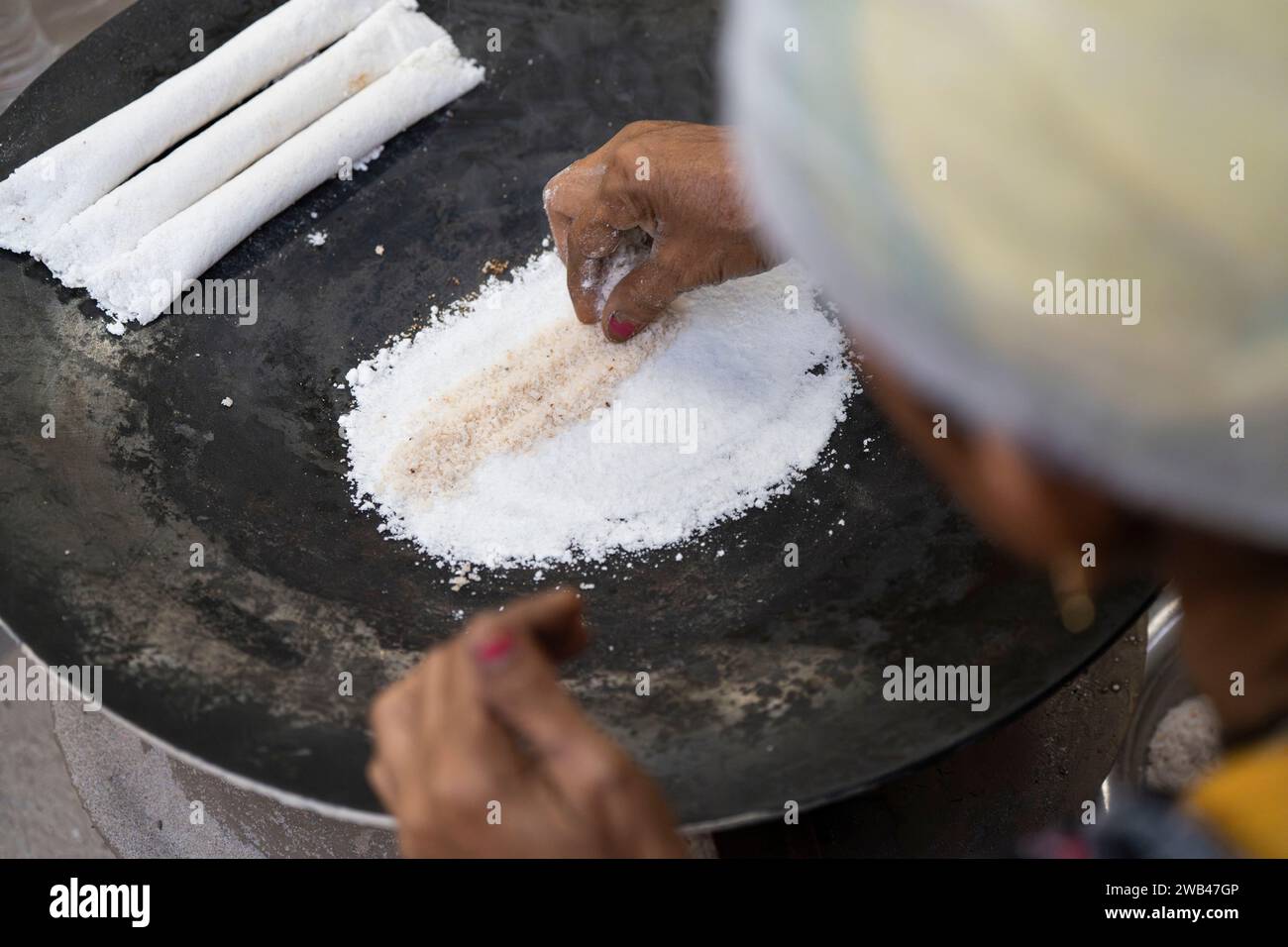 January 8, 2024: Women makes Assamese traditional pitha (Rice cake ...