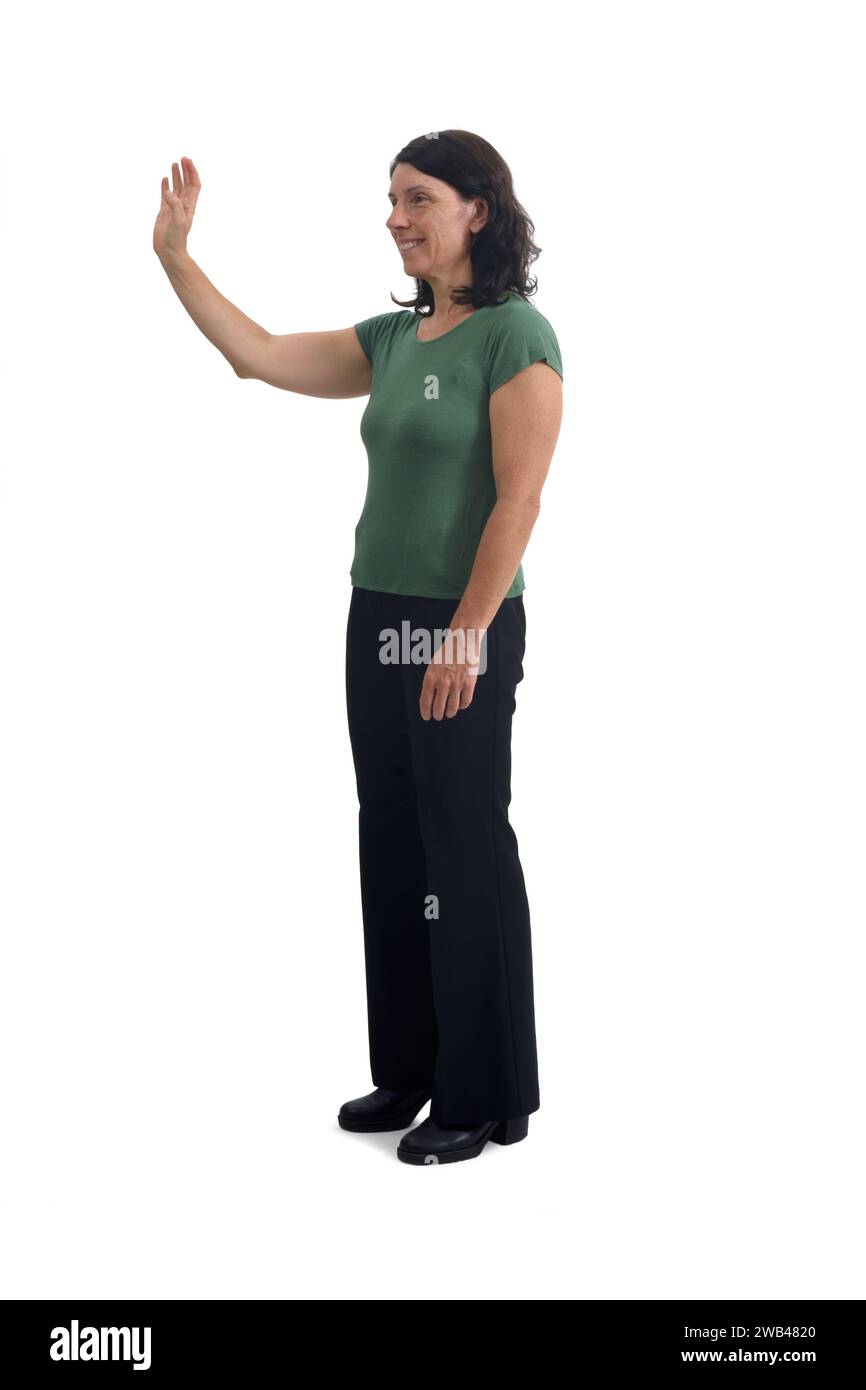 view of a woman standing waving on white background Stock Photo - Alamy