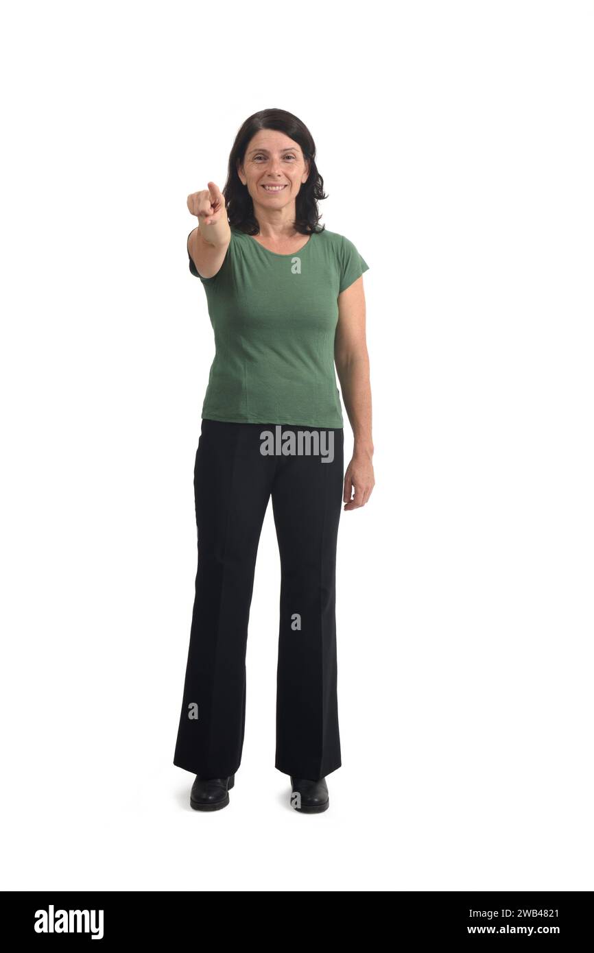 front view of a woman pointing to the front on white background Stock ...
