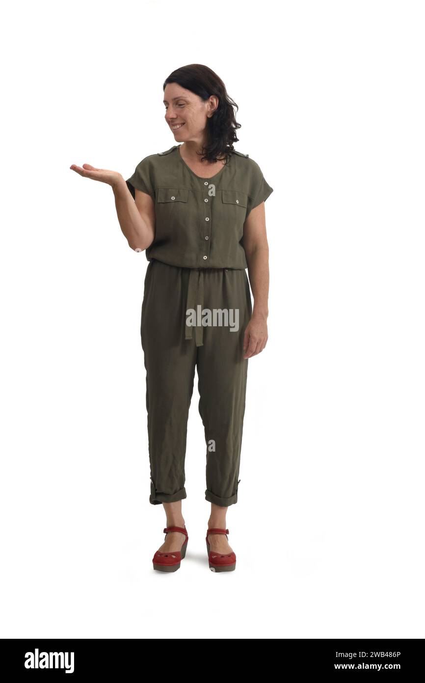 front view of woman showing and looking at an imaginary object in her ...