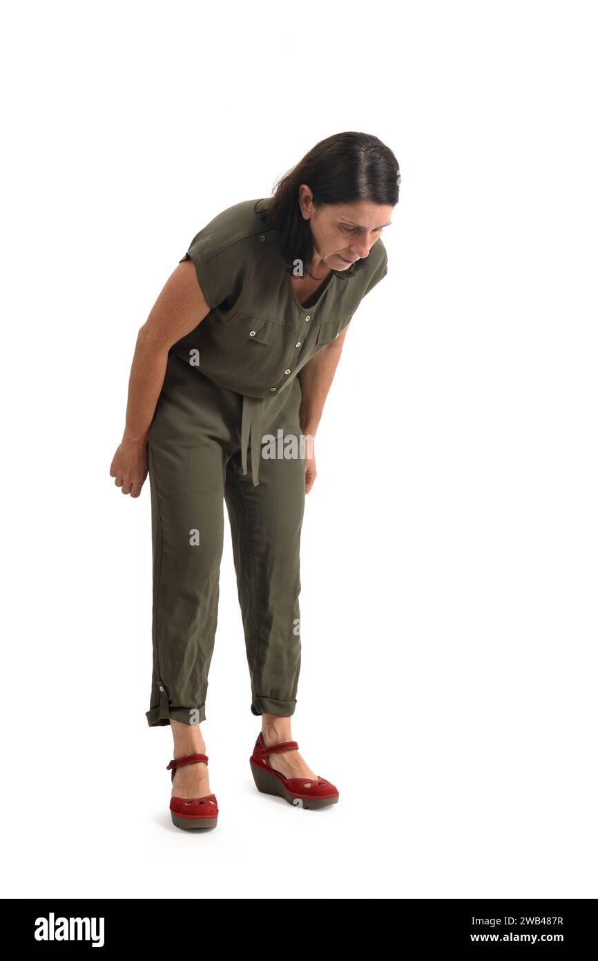 view of a woman standing looking at the floor searching for something ...