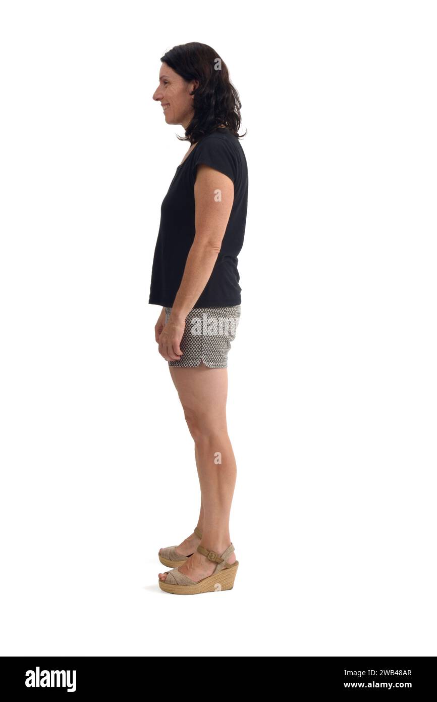 side view of a woman with shorts on white background Stock Photo - Alamy