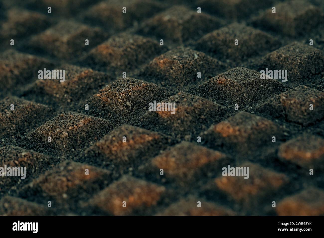 This image features the detailed texture of an empty brown air filter ...