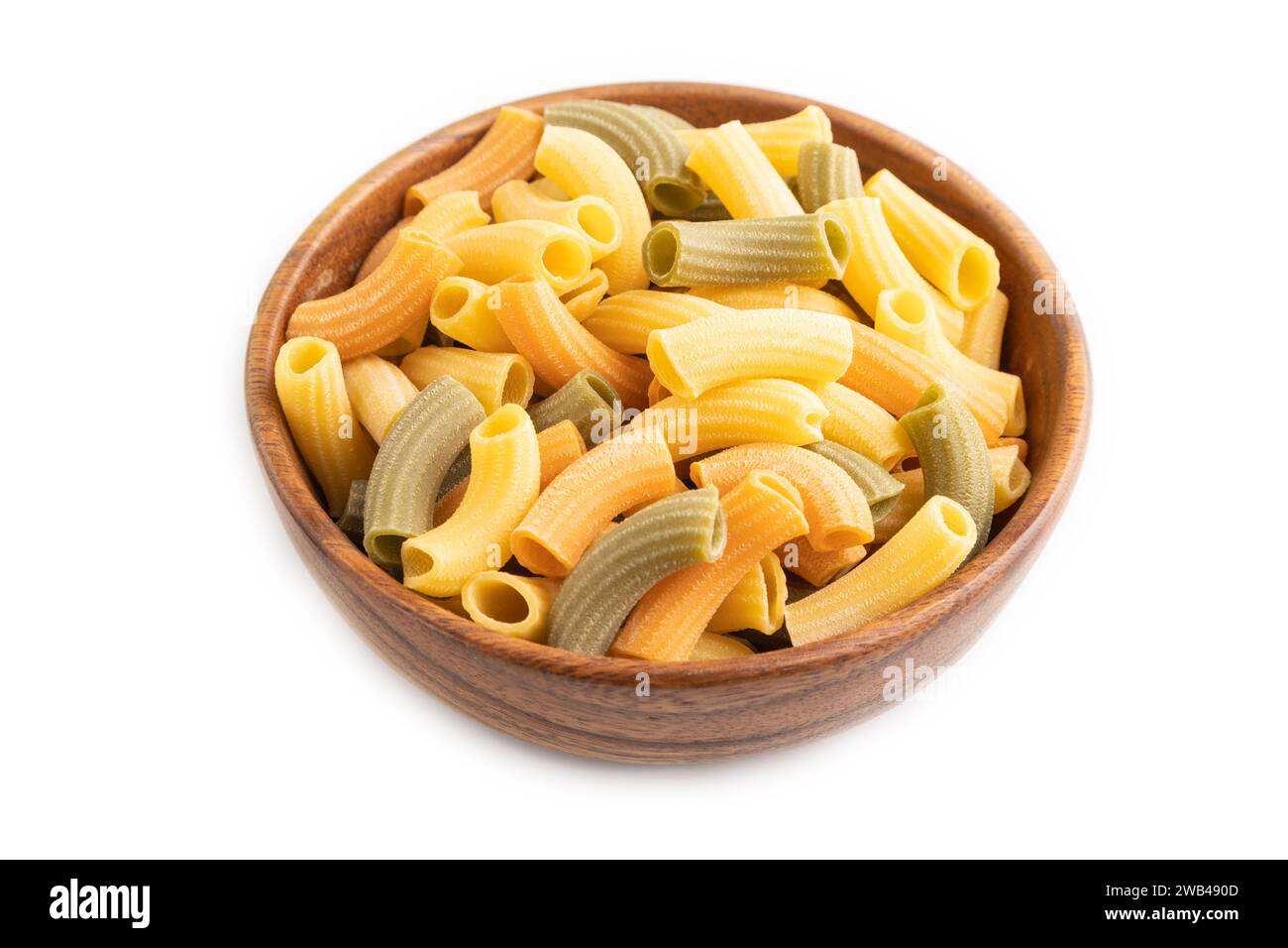 Rigatoni colored raw pasta in wooden bowl isolated on white background ...