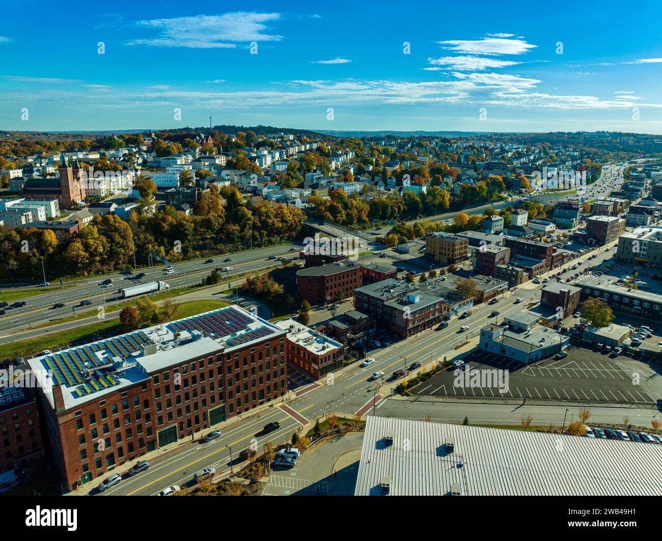 Aerial view of an urban landscape featuring a bustling cityscape with a ...