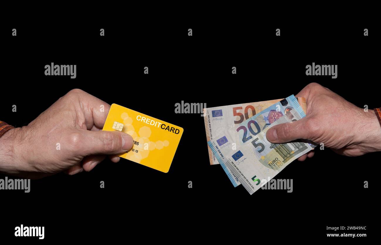 The right hand with euros, the left with a credit card, cash versus ...