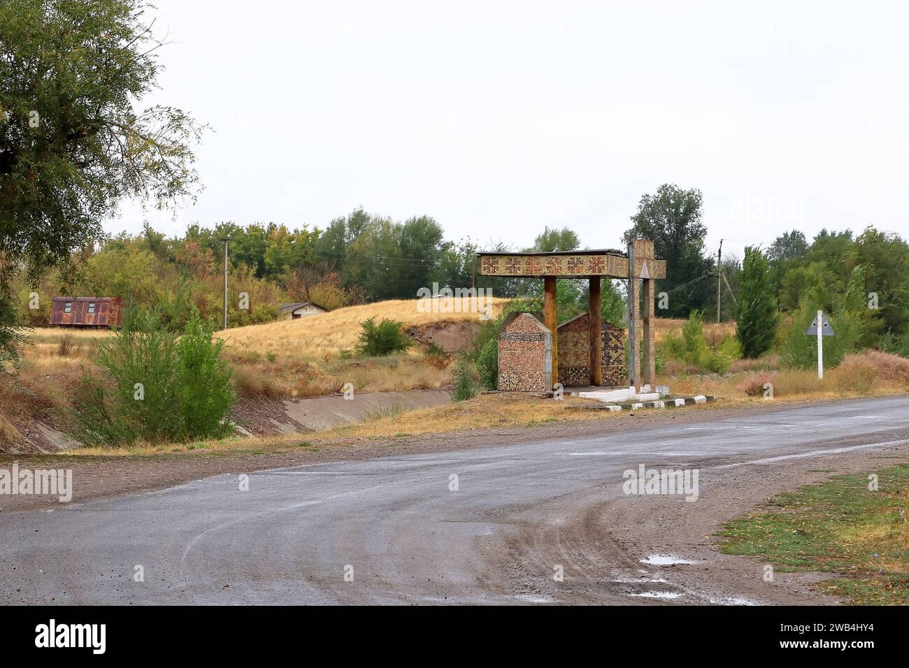 Burana Tower and authentic bus stop view in Kyrgyzstan Stock Photo - Alamy