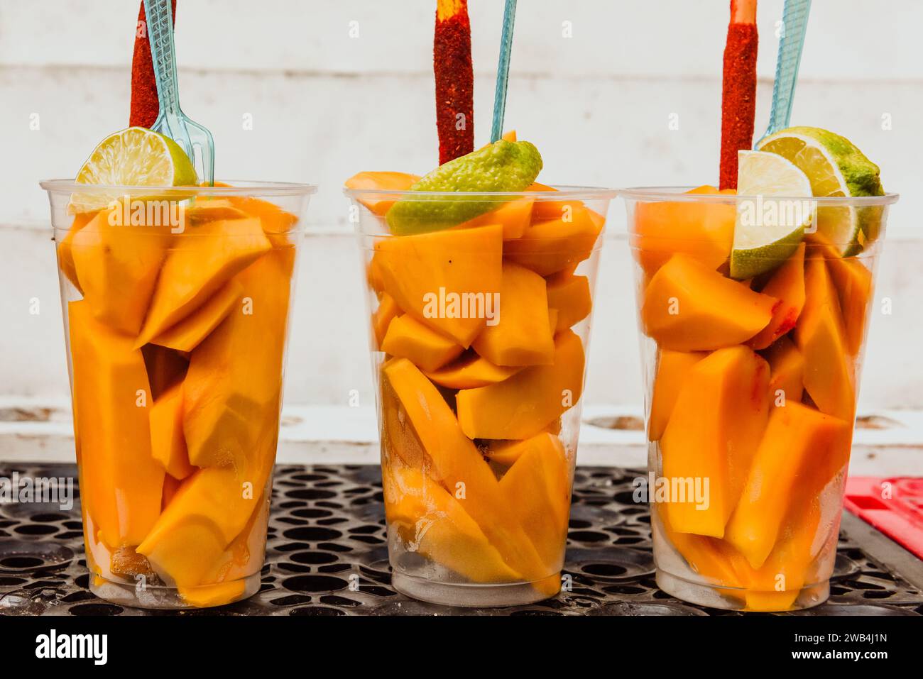 Fresh Mango desserts on sale on stands on the street, Merida, Yucatan ...