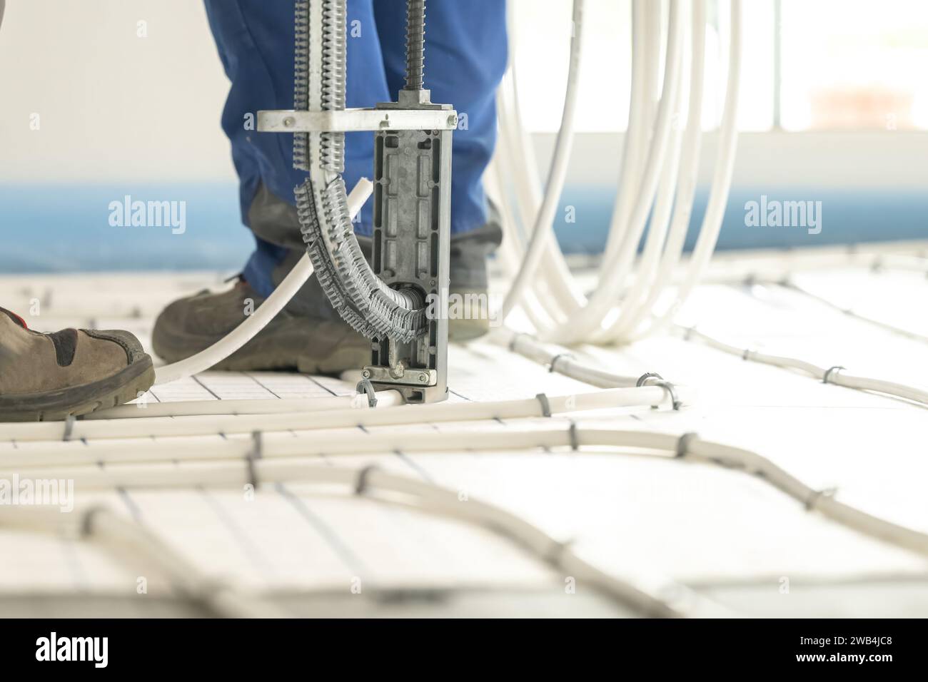 installing floor heating, modernization to save energy Stock Photo - Alamy