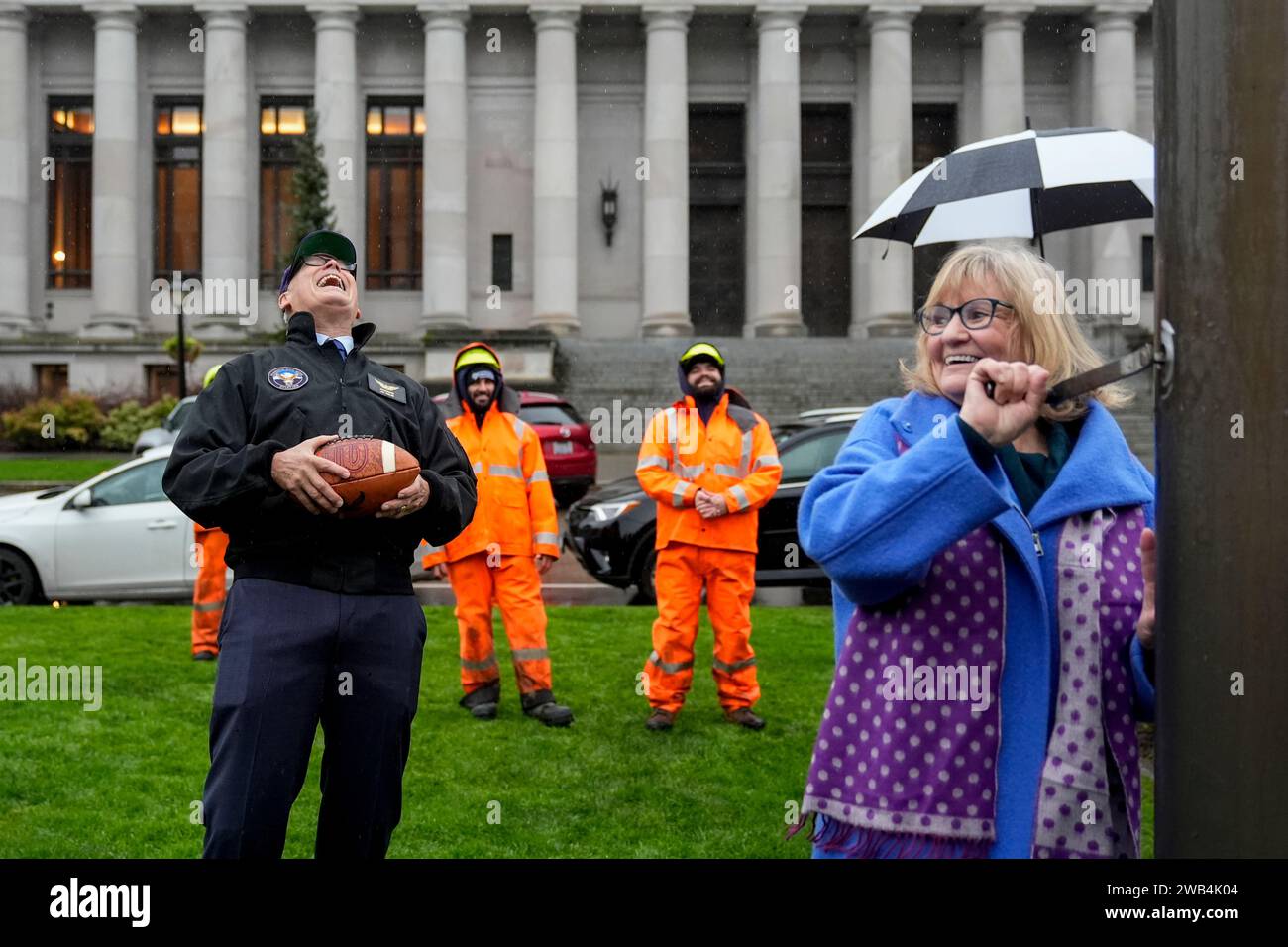 Washington Gov. Jay Inslee laughs as his wife Trudi Inslee, who ...