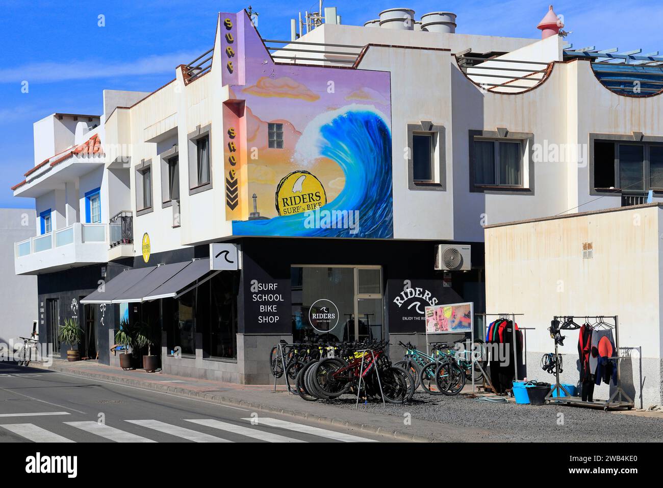 Surf shop and hire shop with colourful wall painting, El Cotillo, Fuerteventura, Canary Islands ...