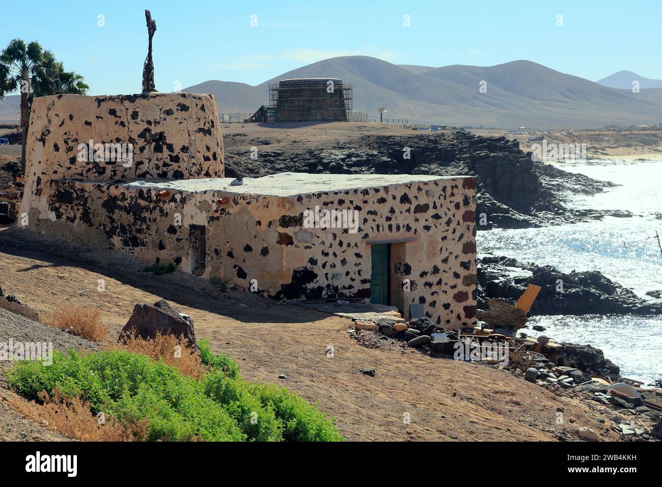 Old buildings with fish tail artwork, near the harbour at El Cotillo ...