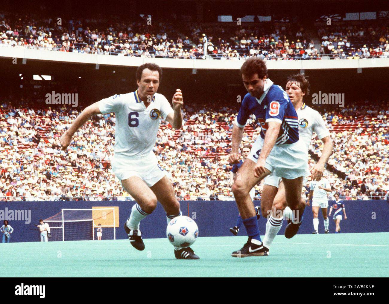 FILE - New York Cosmos Franz Beckenbauer (6) battles for the ball ...