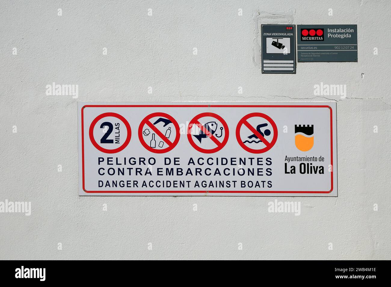 Danger sign in Spanish, El Cotillo harbour, Fuerteventura, Canary ...