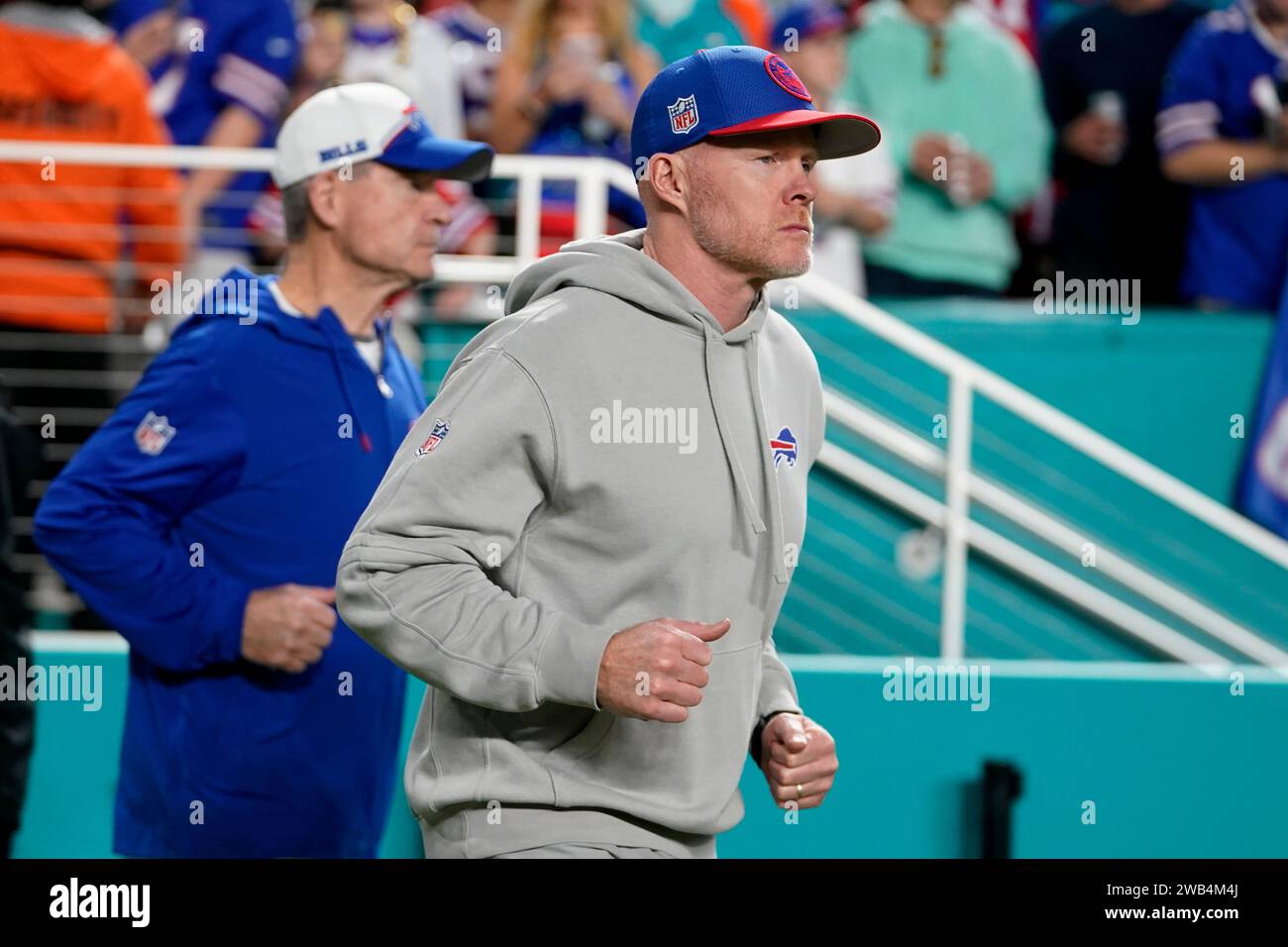 Buffalo Bills head coach Sean McDermott, right, runs onto the field ...