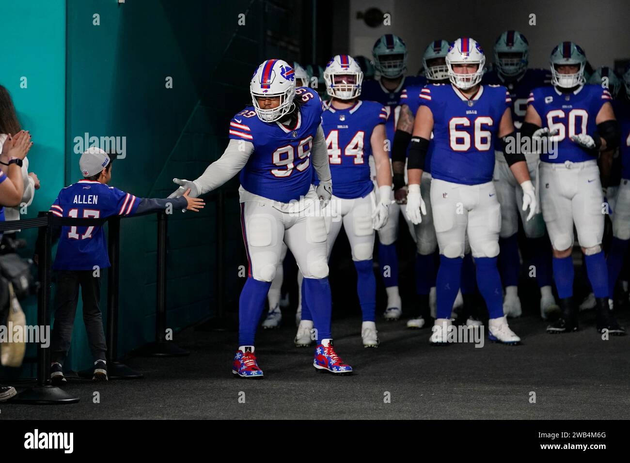 Buffalo Bills defensive tackle Tim Settle (99) greets a fan before an ...