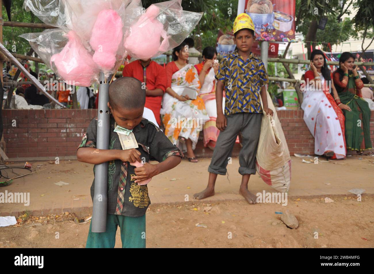 A child selling cotton candy on New Year's Day. Rabindra Sarabar, Dhaka ...